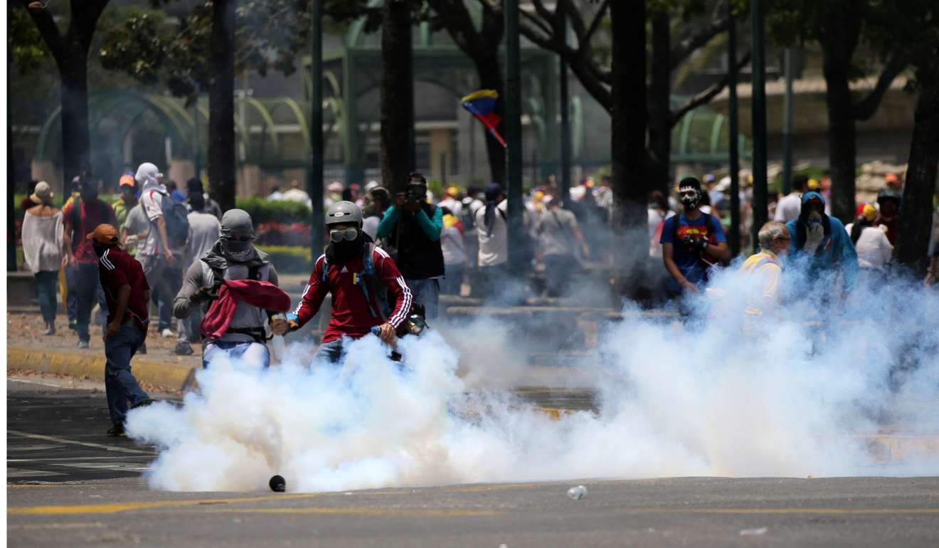 Boy aged 13 is among four killed as Venezuela riots target embattled ...
