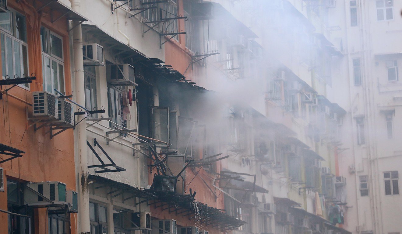 Fire hits Hong Kong residential block, injuring two as 130 others ...